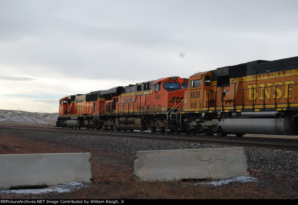 BNSF 5891, and 8890 push a loaded coal train north to donkey creek.